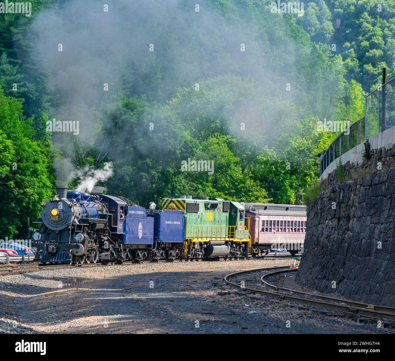 View of a Restored Steam Passenger Train Blowing Smoke and Steam ...