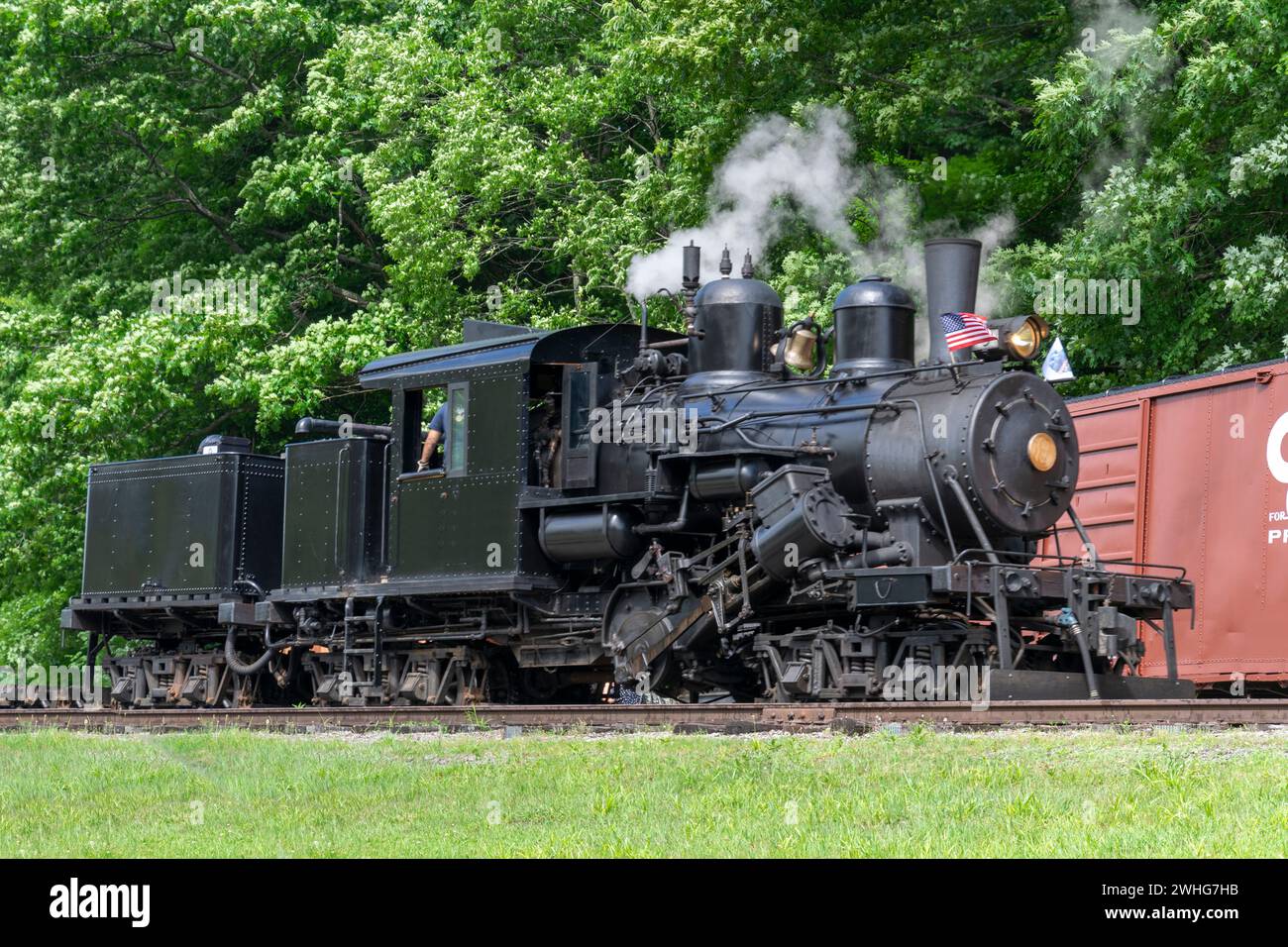 View of a Antique Shay Steam Engine Moving Slowly Blowing Smoke and ...
