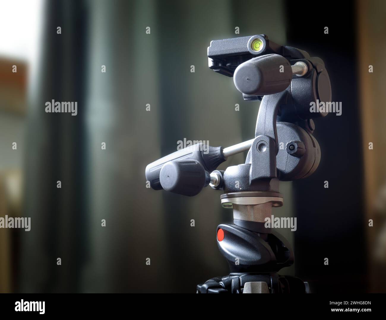 High quality 3-axis tripod head for the camera. Mounted on a tripod ...