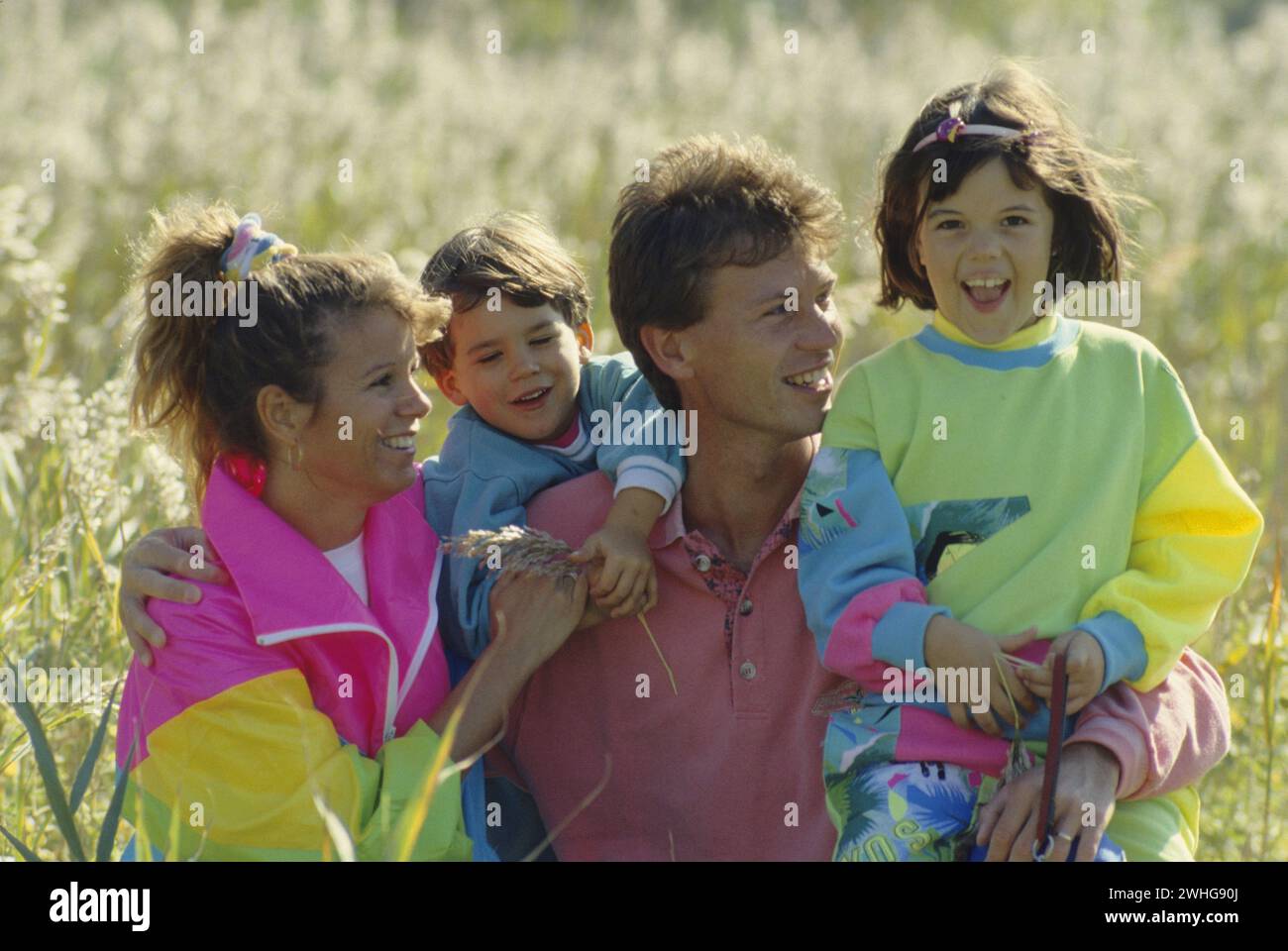 family happy together very happy alltogether colored clothes on natural ...