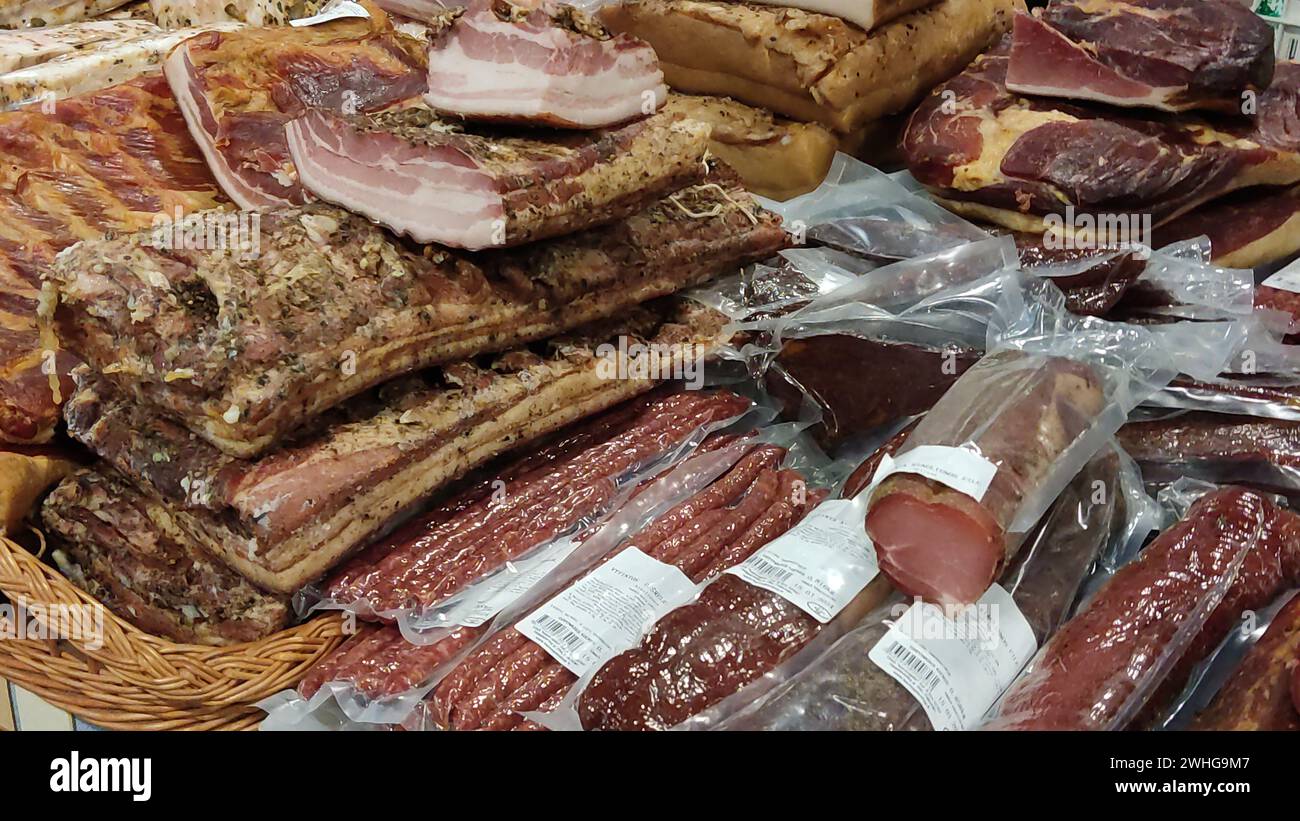 Smoked meat products sausage, frankfurters, lard. Close-up of meat ...
