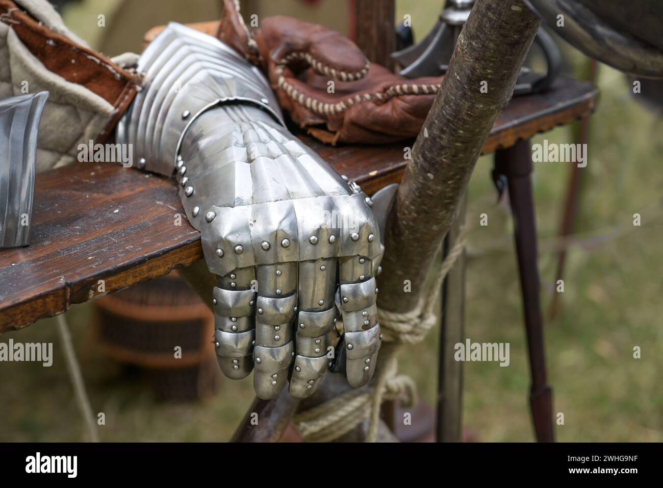 Protective gauntlet from metal plates as fully fingered glove, part of ...