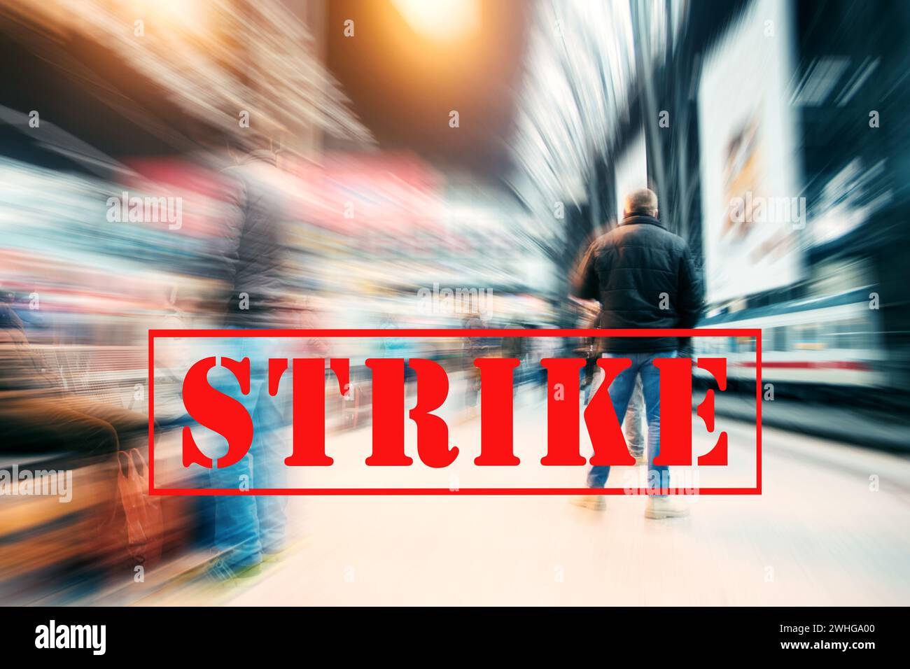 Man waiting for the train on a platform in the big city railway station ...