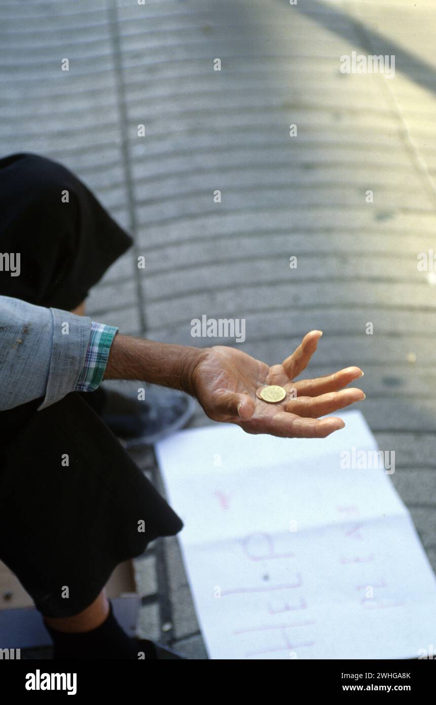 homeless beggar hand begging for money Stock Photo - Alamy
