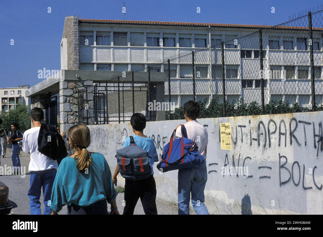 French college building students walking aside of wall with graffiti ...