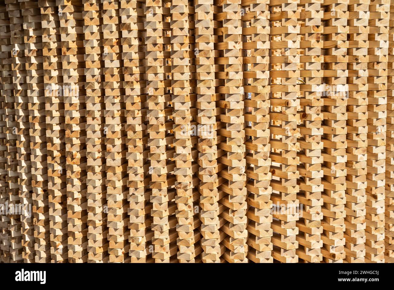 Tall wooden sculpture of small blocks Stock Photo - Alamy