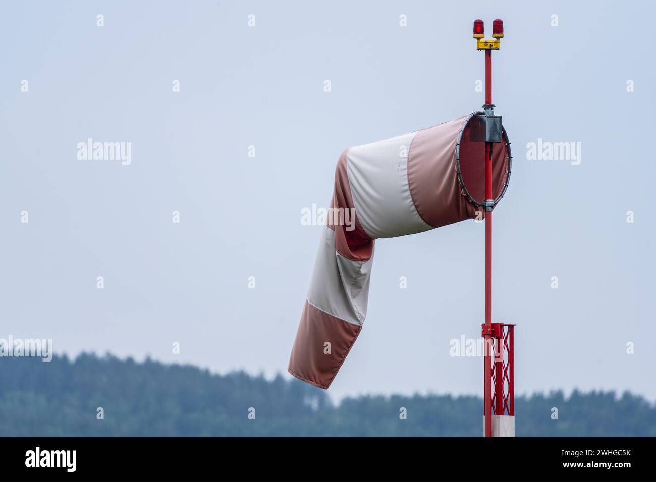 Airport windsock measuring wind speed Stock Photo - Alamy