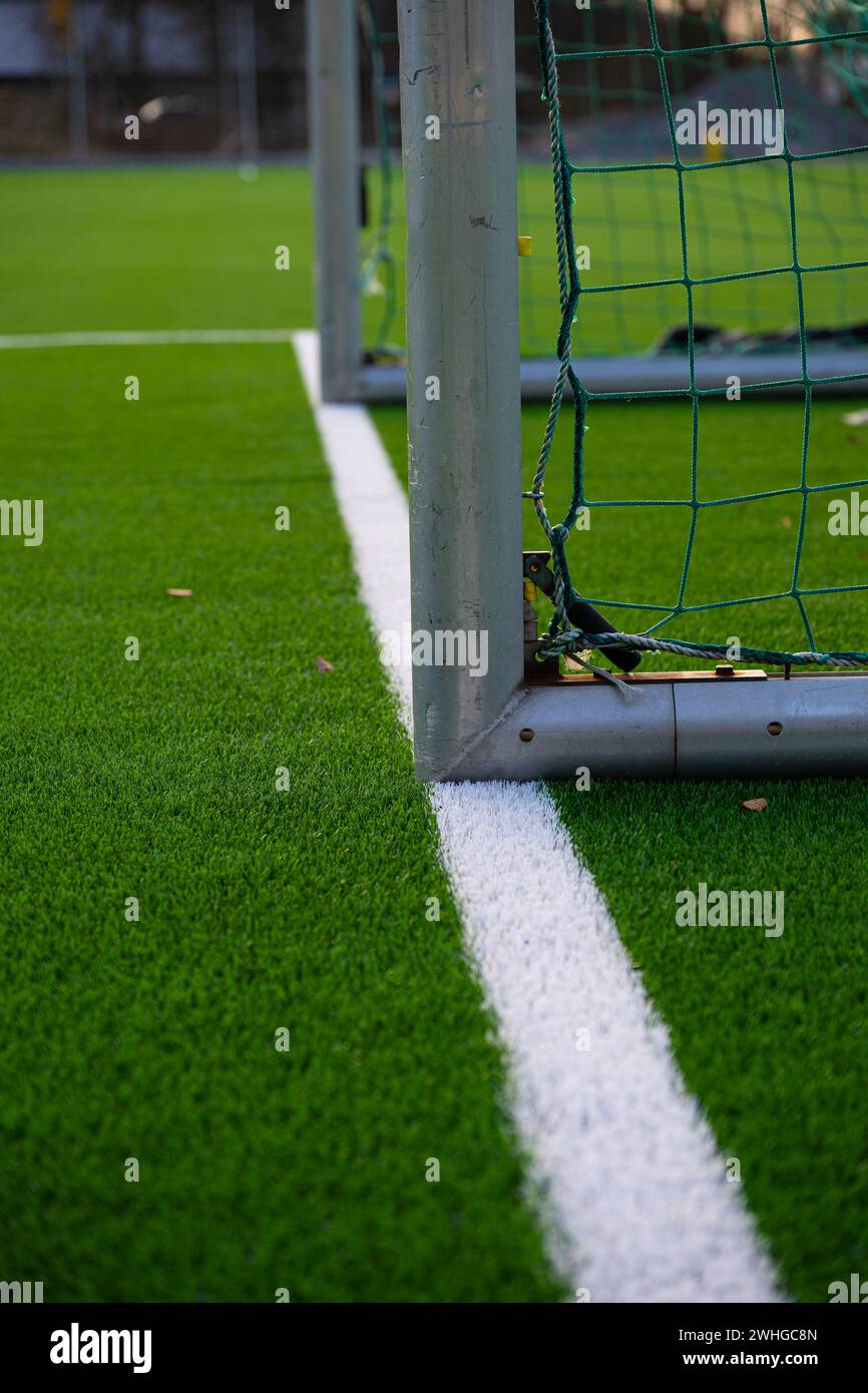 White markings and goal post of an artificial turf football field Stock ...