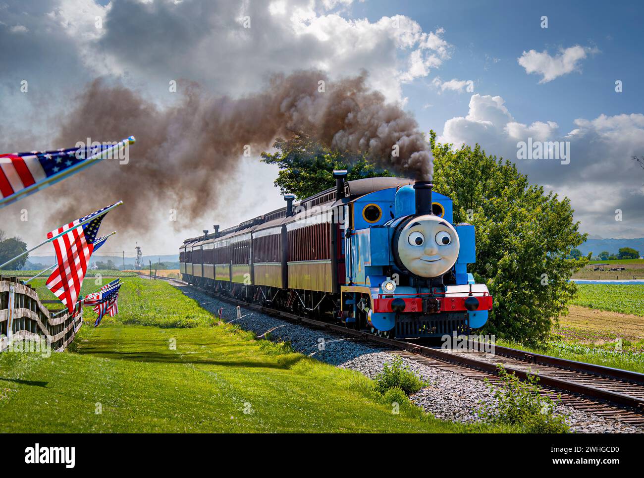 View of Thomas the Train Pulling Passenger Cars While Passing American ...