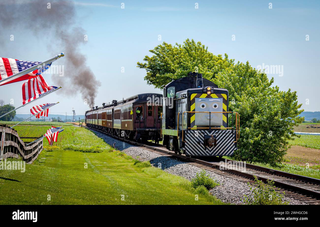 View of Thomas the Train Pulling Passenger Cars While Passing American ...