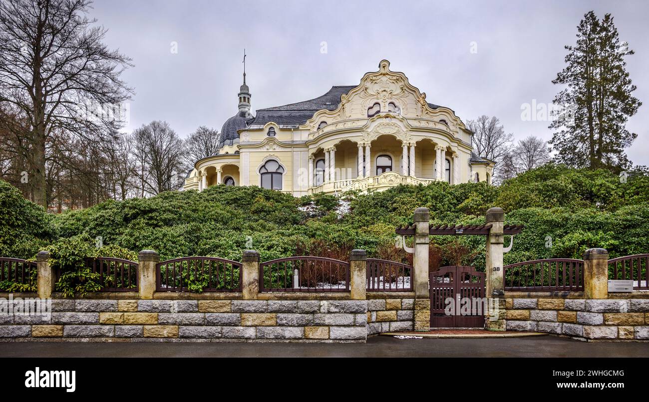 The villa behind the rhododendrons Stock Photo - Alamy