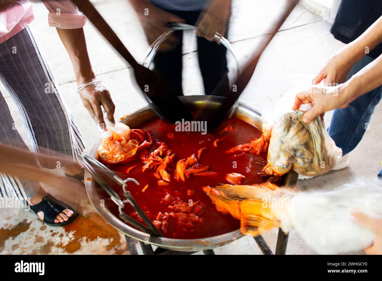 Thai people study learning batik ikat and tie dye natural orange color ...