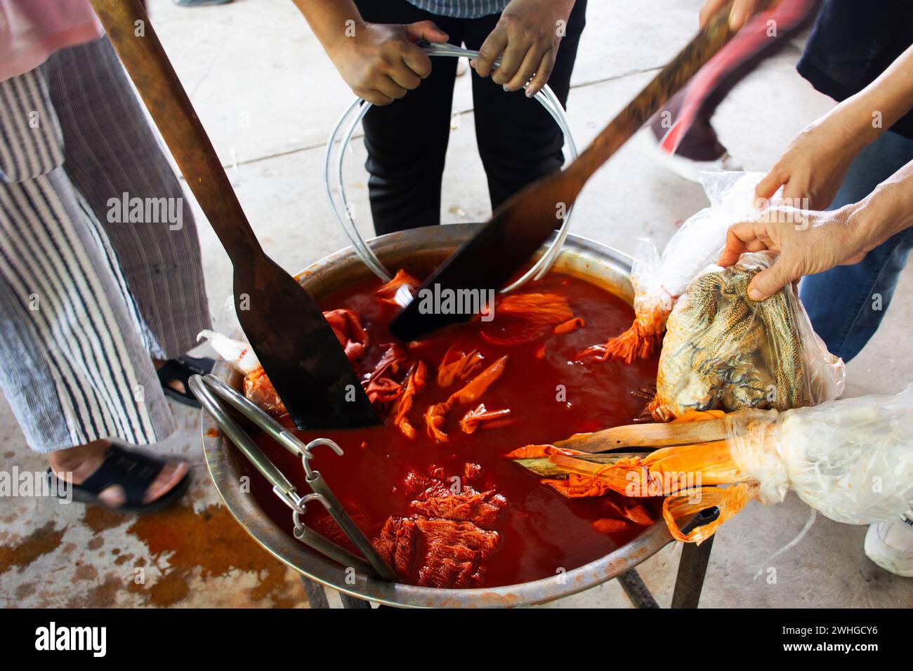Thai people study learning batik ikat and tie dye natural orange color ...