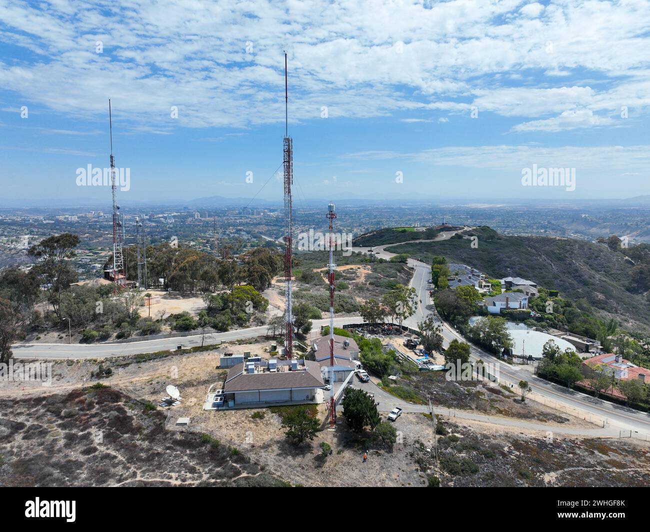 Engineer with safety equipment on high tower for working telecom ...