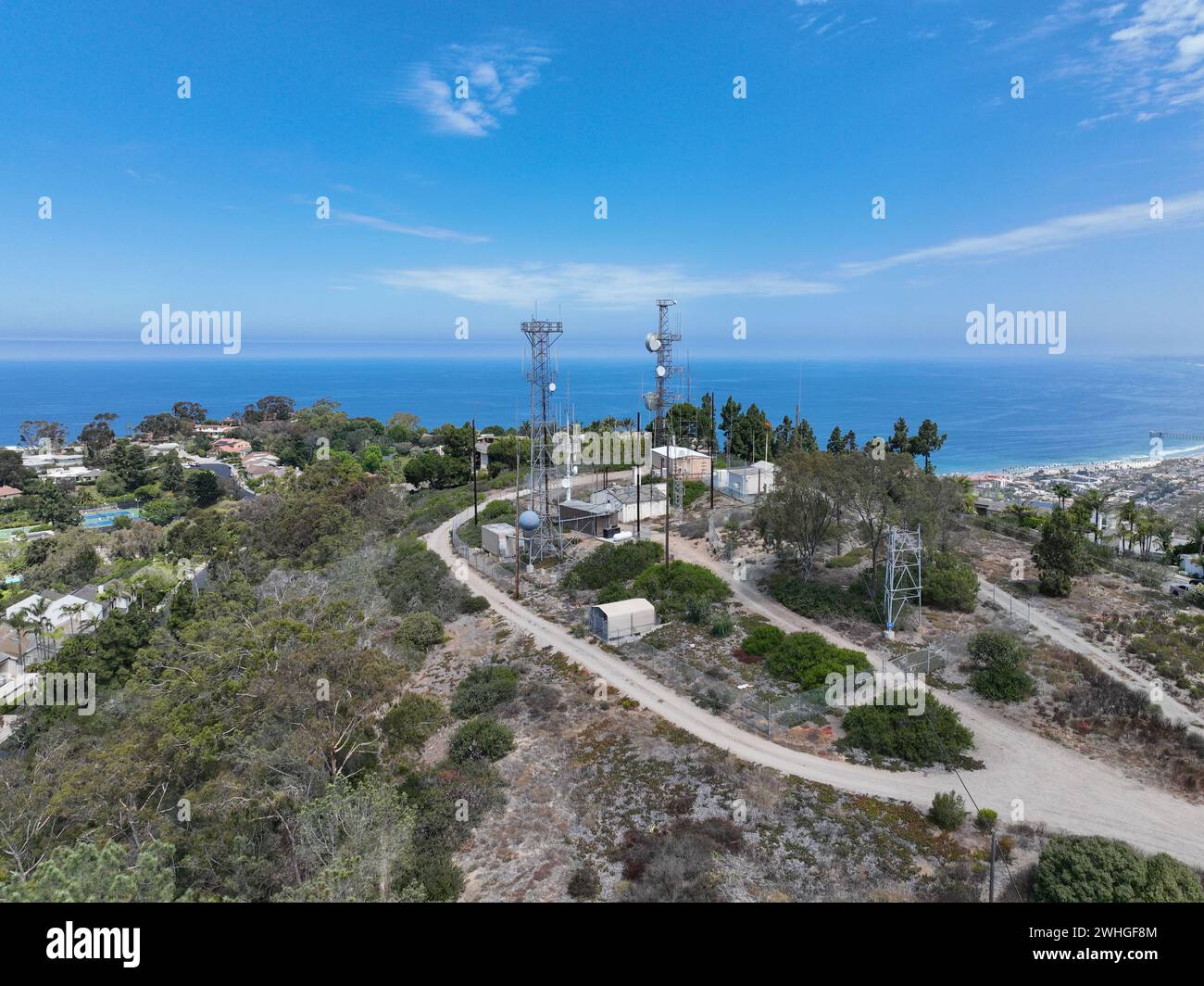 Engineer with safety equipment on high tower for working telecom ...