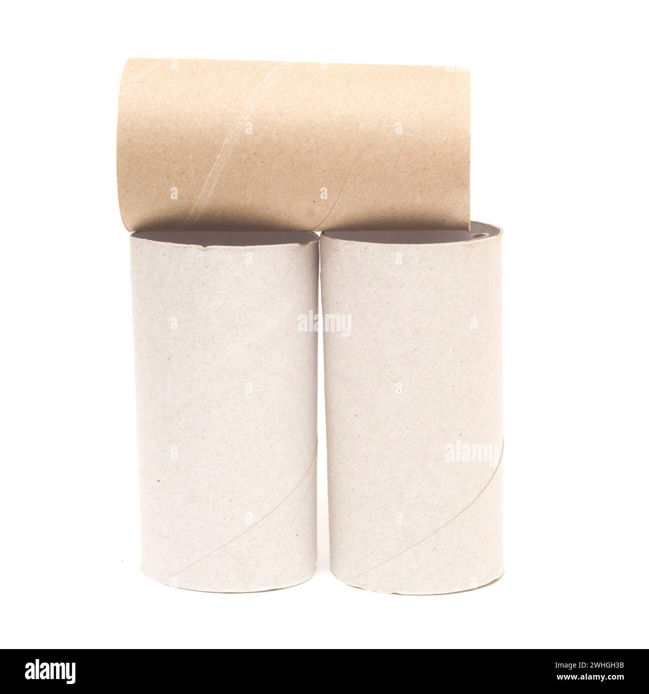 Three empty toilet rolls isolated on white background Stock Photo - Alamy