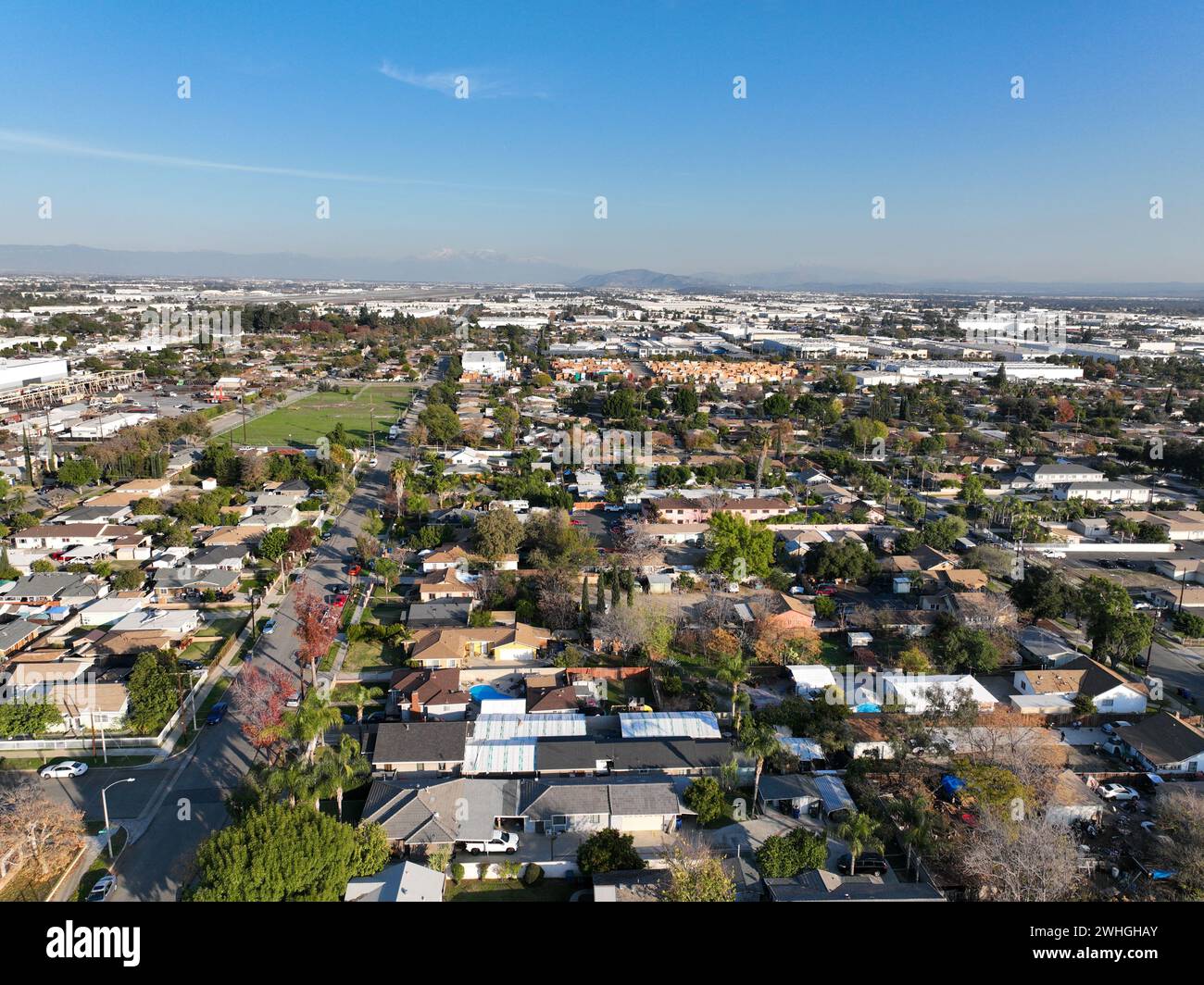 Aerial view of Ontario city in California with mountains in the ...
