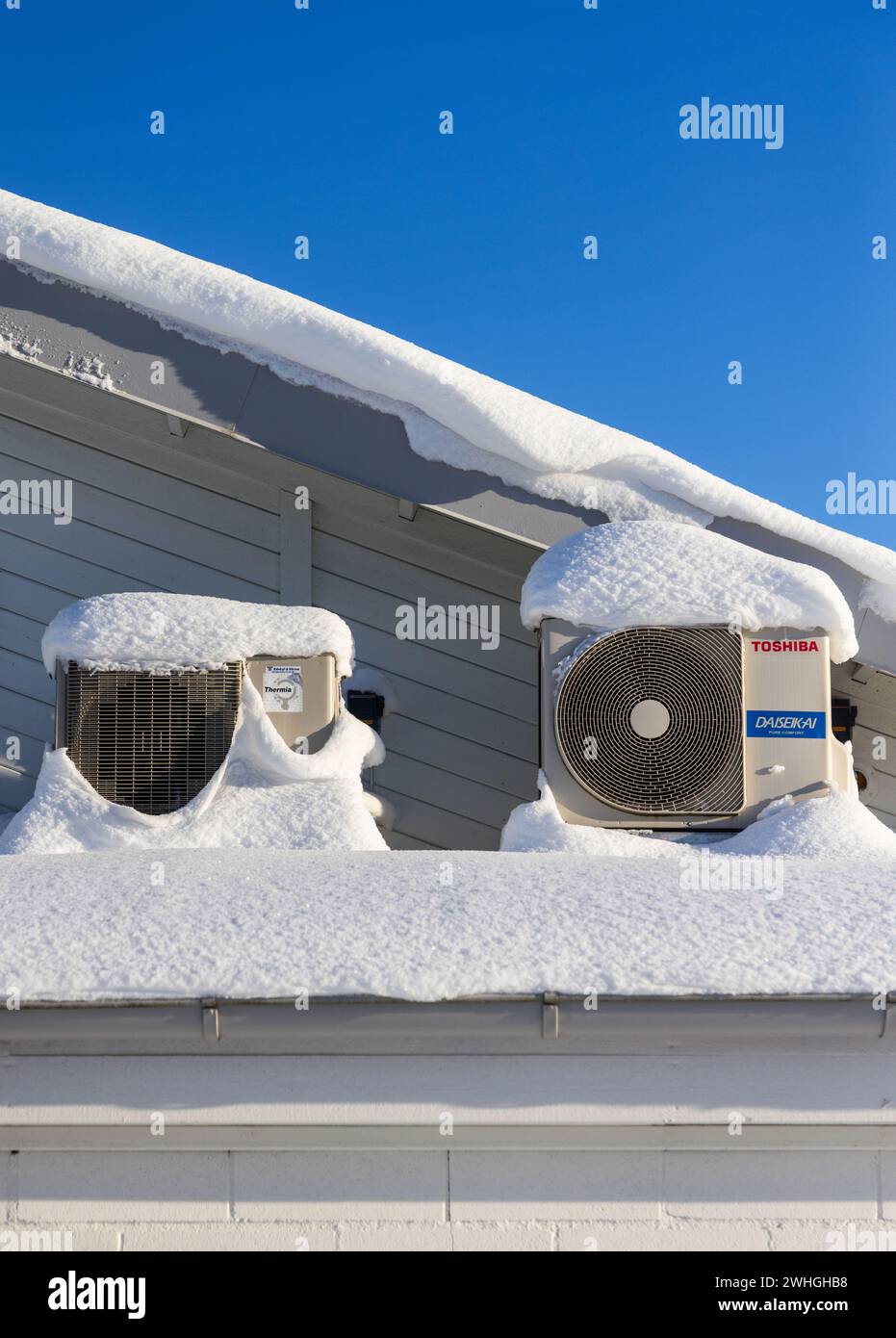 Seasonal weather, heat pumps on a building Stock Photo - Alamy