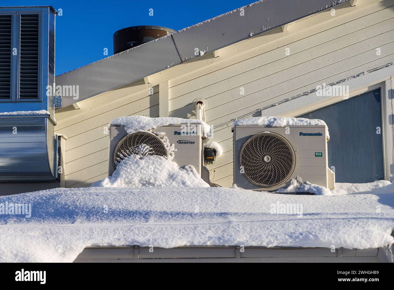 Seasonal weather, heat pumps on a building Stock Photo - Alamy