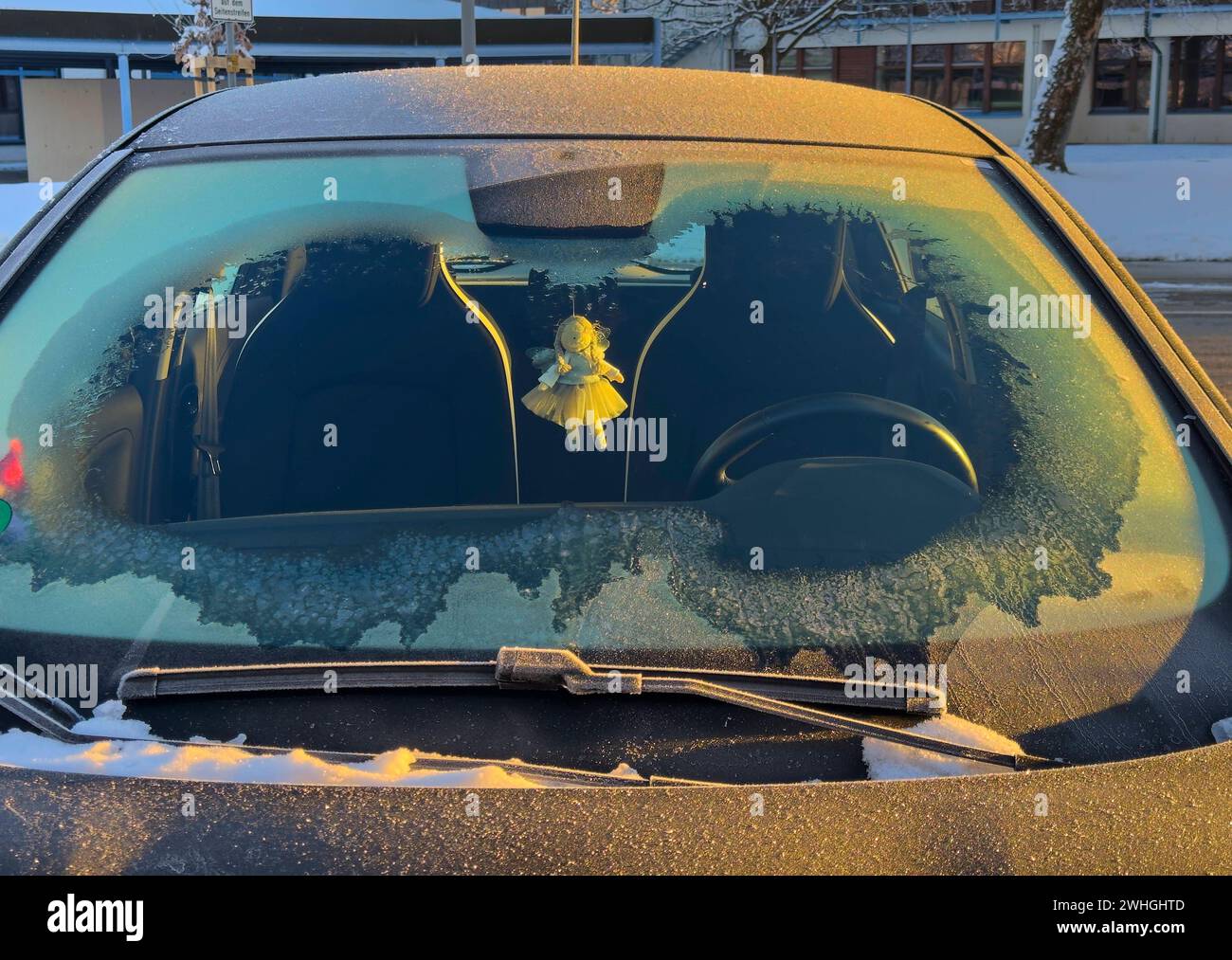 Electric car with frozen front window and Guardian Angel after the ...