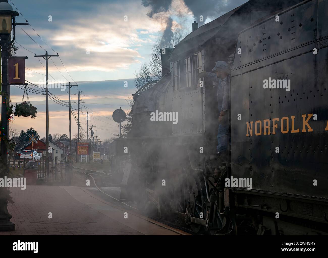 View of a Classic Steam Passenger Train Arriving into a Train Station ...
