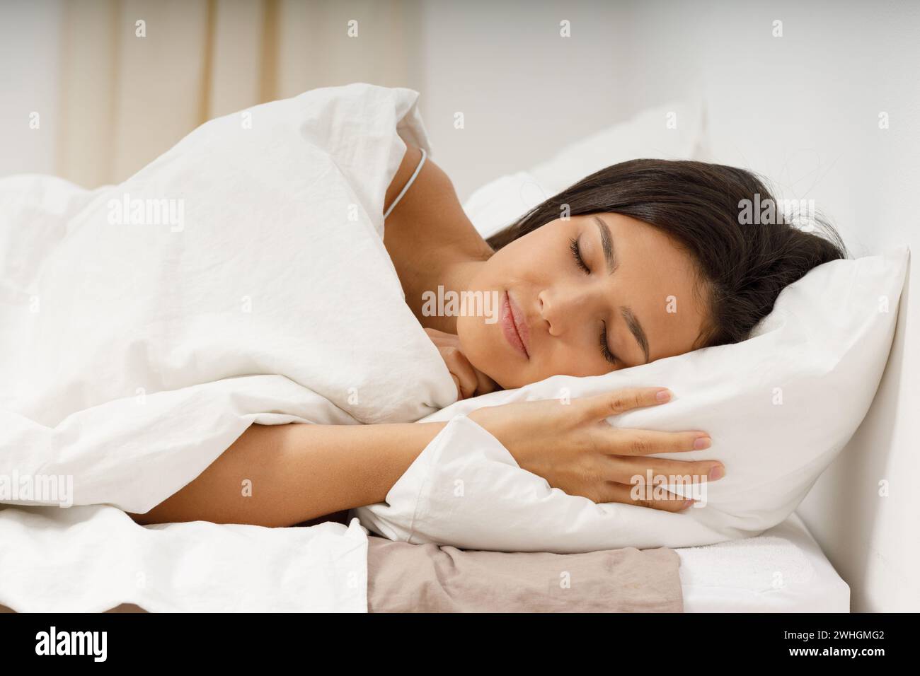 Healthy young woman covers blanket sleeping with closed eyes on bed in bedroom Stock Photo - Alamy