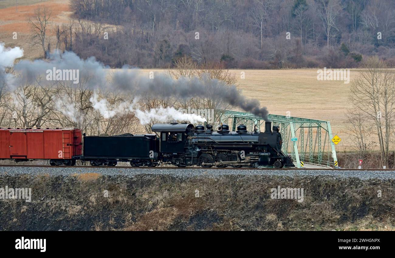 View of a Narrow Gauge Restored Steam Freight Train Blowing Smoke and ...