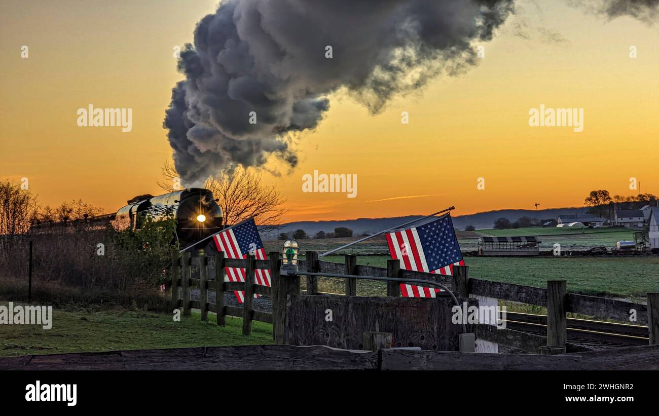 Antique Stream Passenger Train, Traveling at Sunrise, While passing a ...