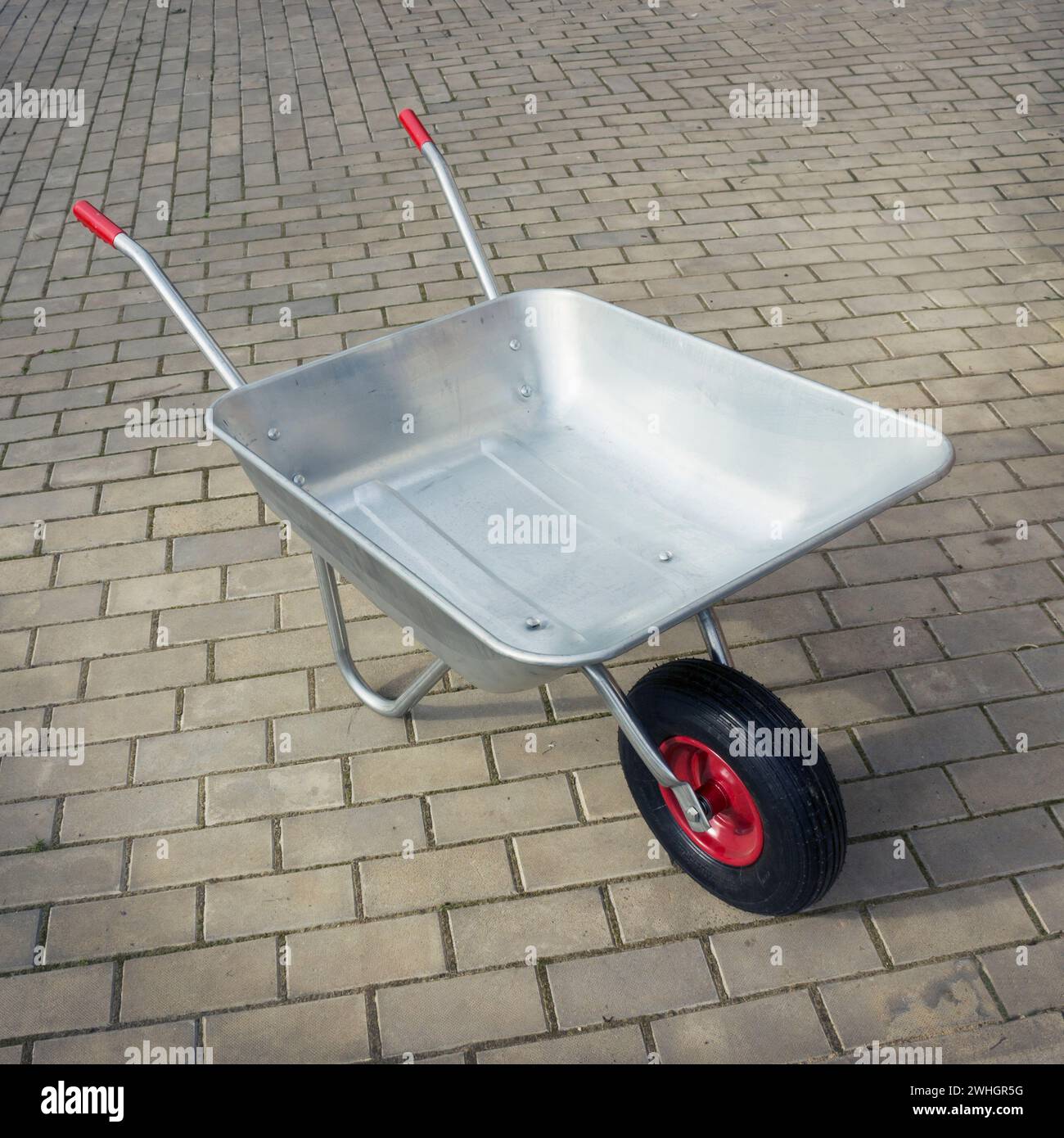 Wheelbarrow. Garden one-wheeled metal cart Stock Photo - Alamy