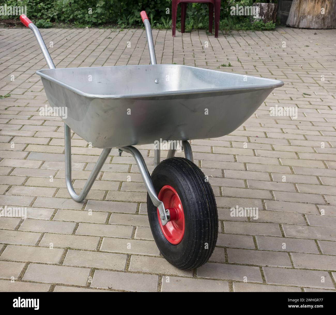 Wheelbarrow on stone floor. Garden cart with pneumatic wheel Stock ...