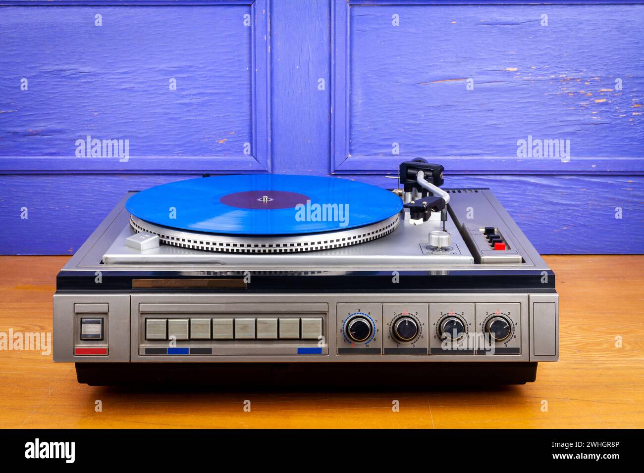 Vintage turntable vinyl record player with blue vinyl on a table Stock ...