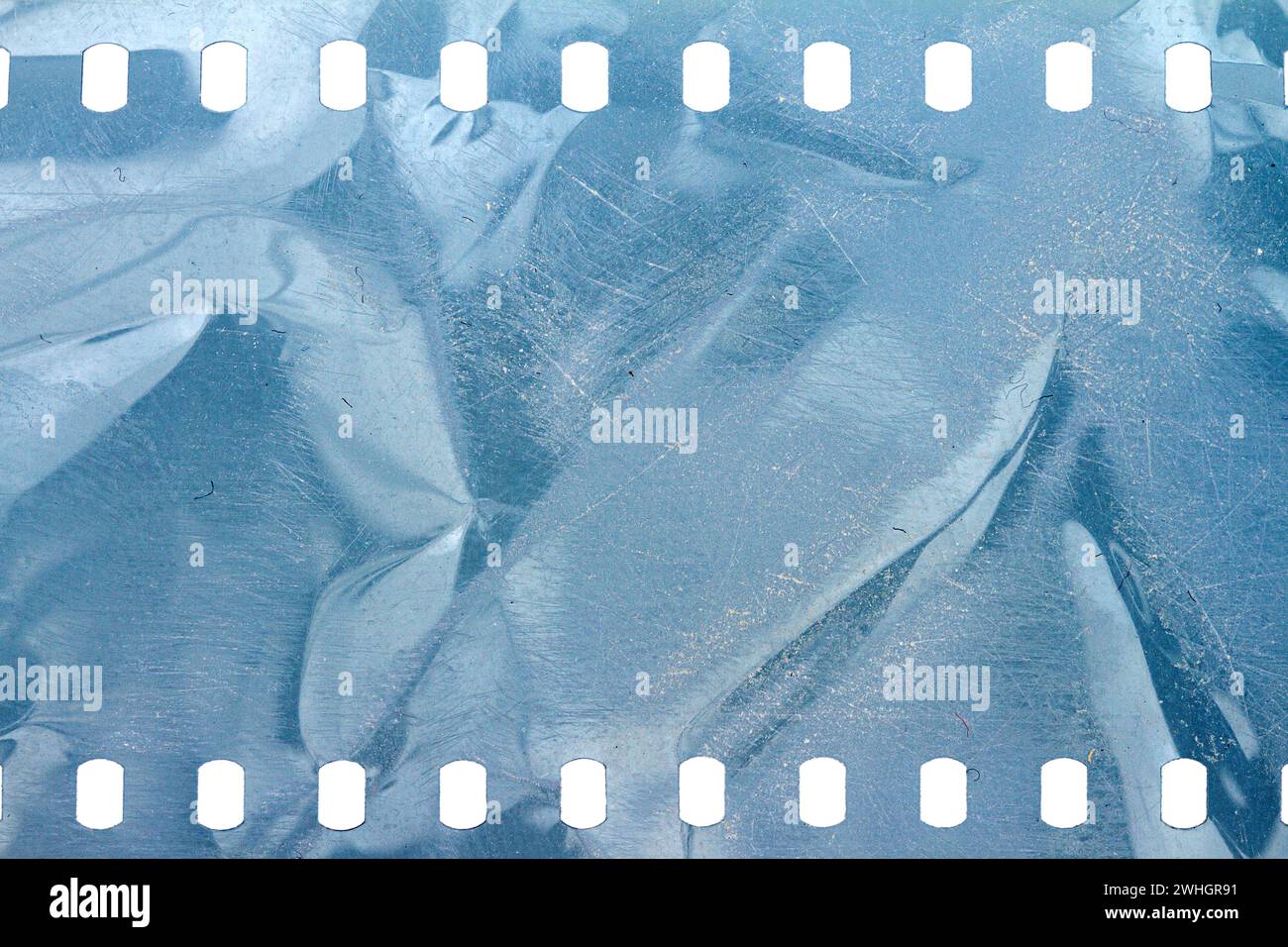 Dusty and grungy 35mm film texture or surface. Perforated scratched ...