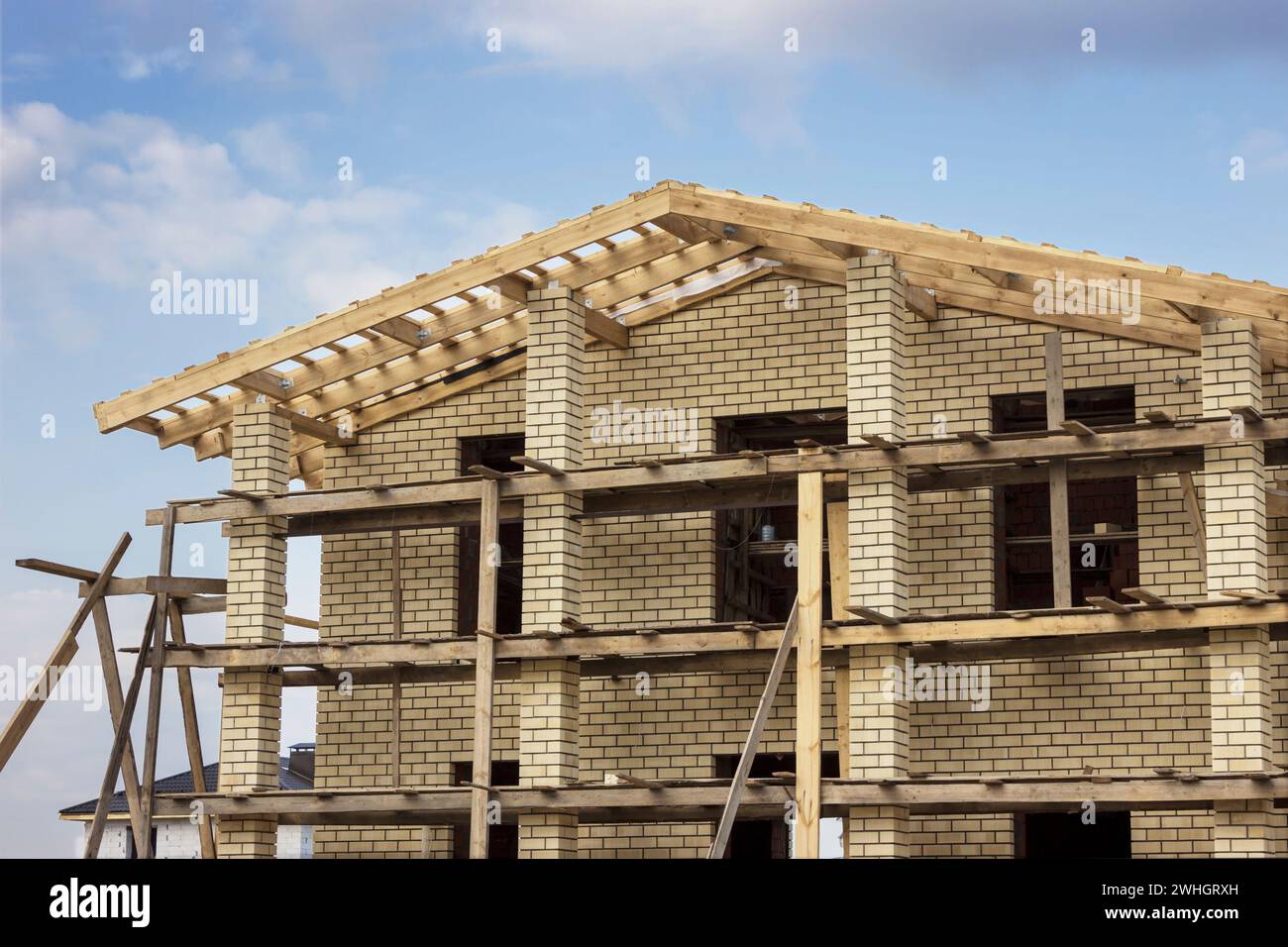 Wooden roof on a brick house under construction Stock Photo - Alamy