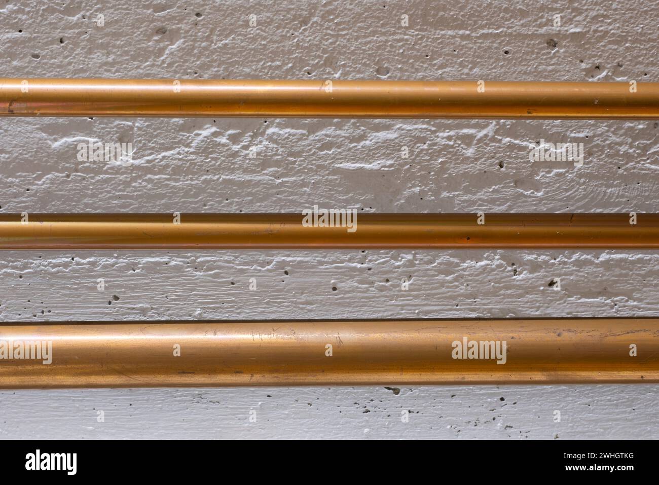 Three copper pipe side by side Stock Photo - Alamy