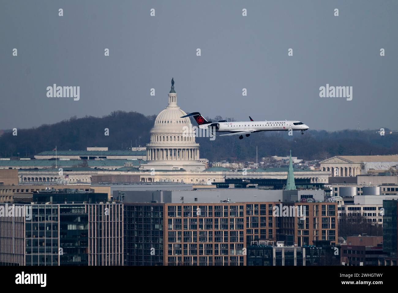 An Air Canada Canadair Regional Jet CRJ-900 plane flies past the U.S ...