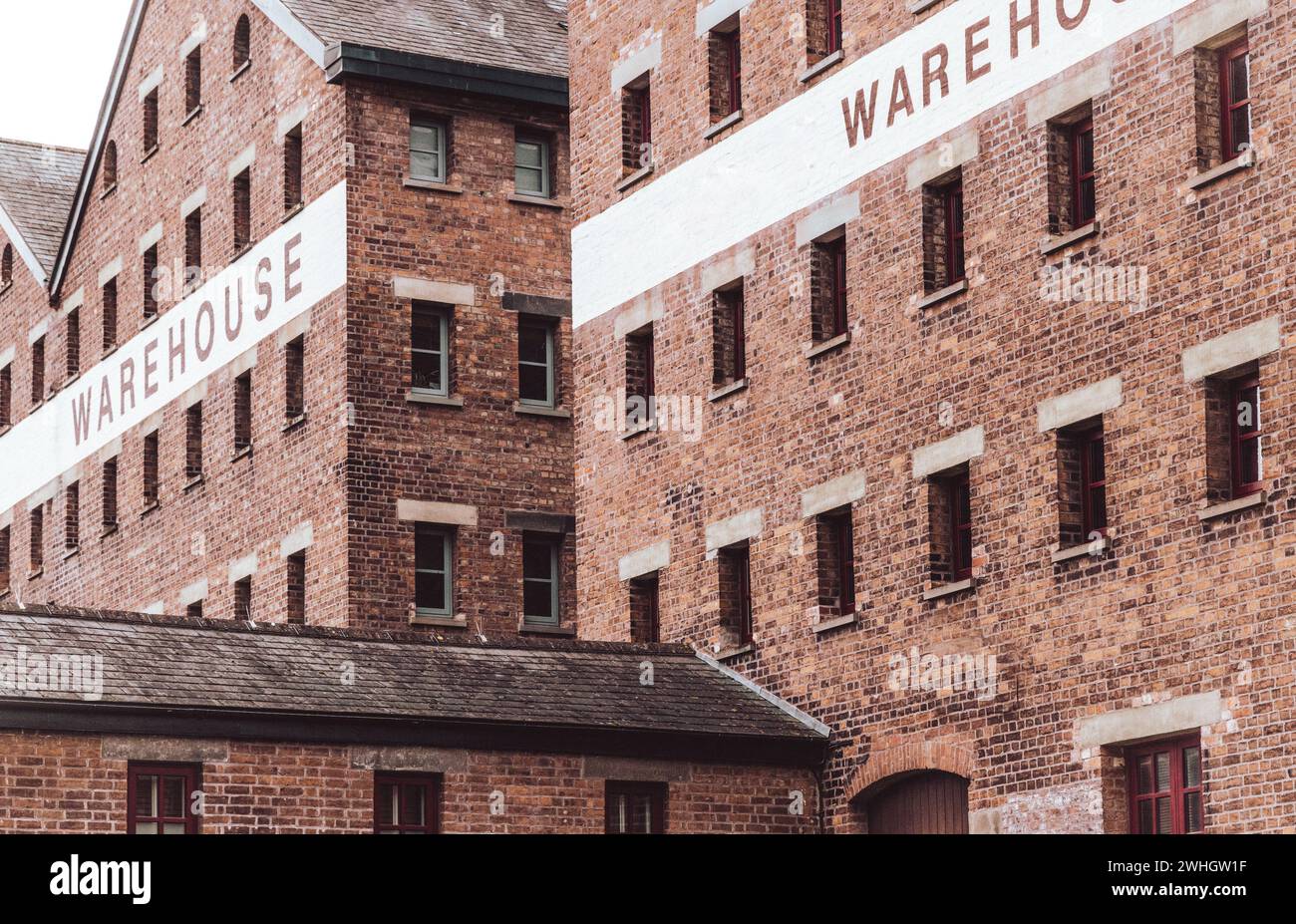 The red brick buildings with signs. Old warehouse buildings Stock Photo ...