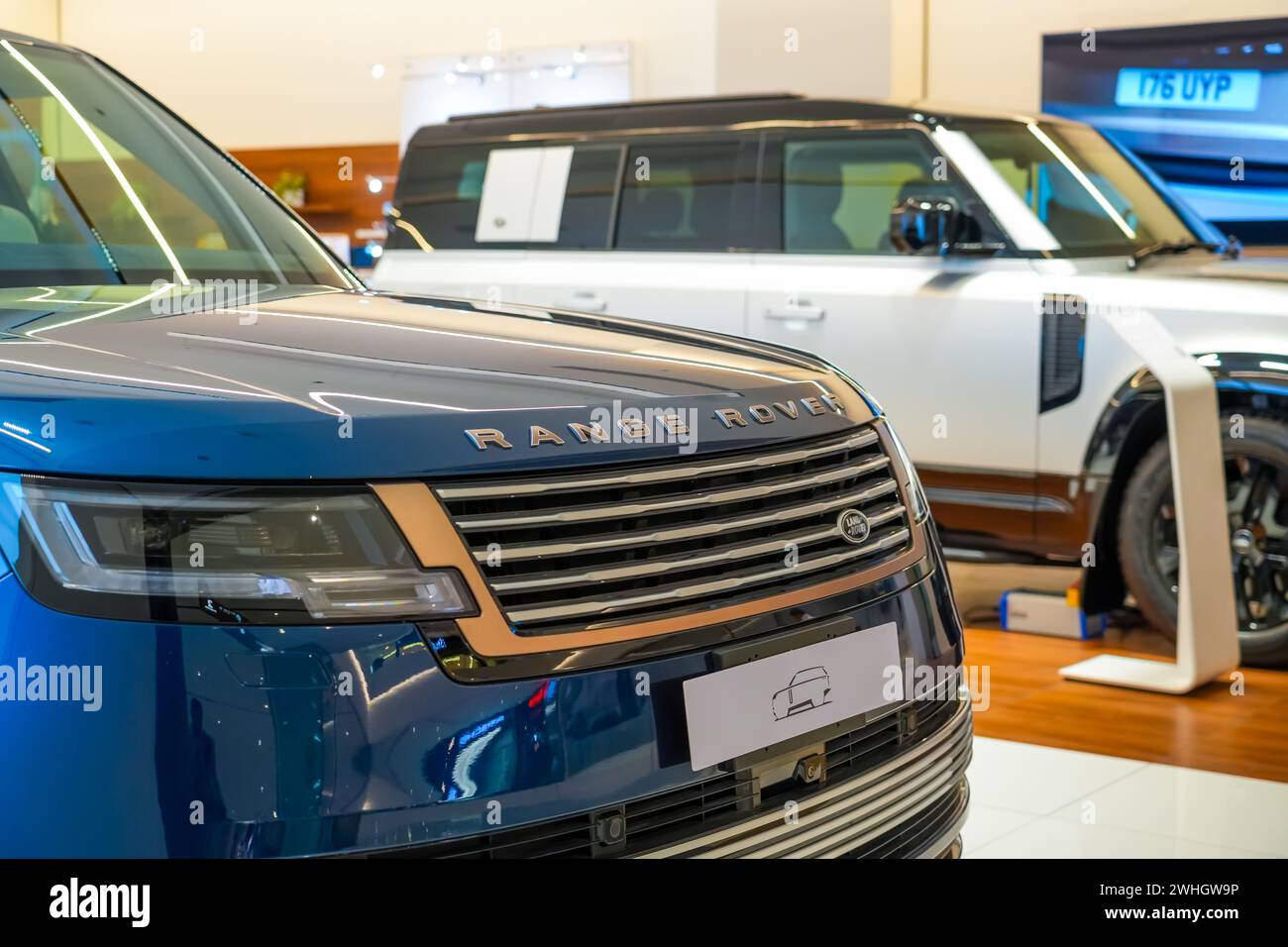Land Range Rover blue in the showroom on the shop showcase exhibition ...
