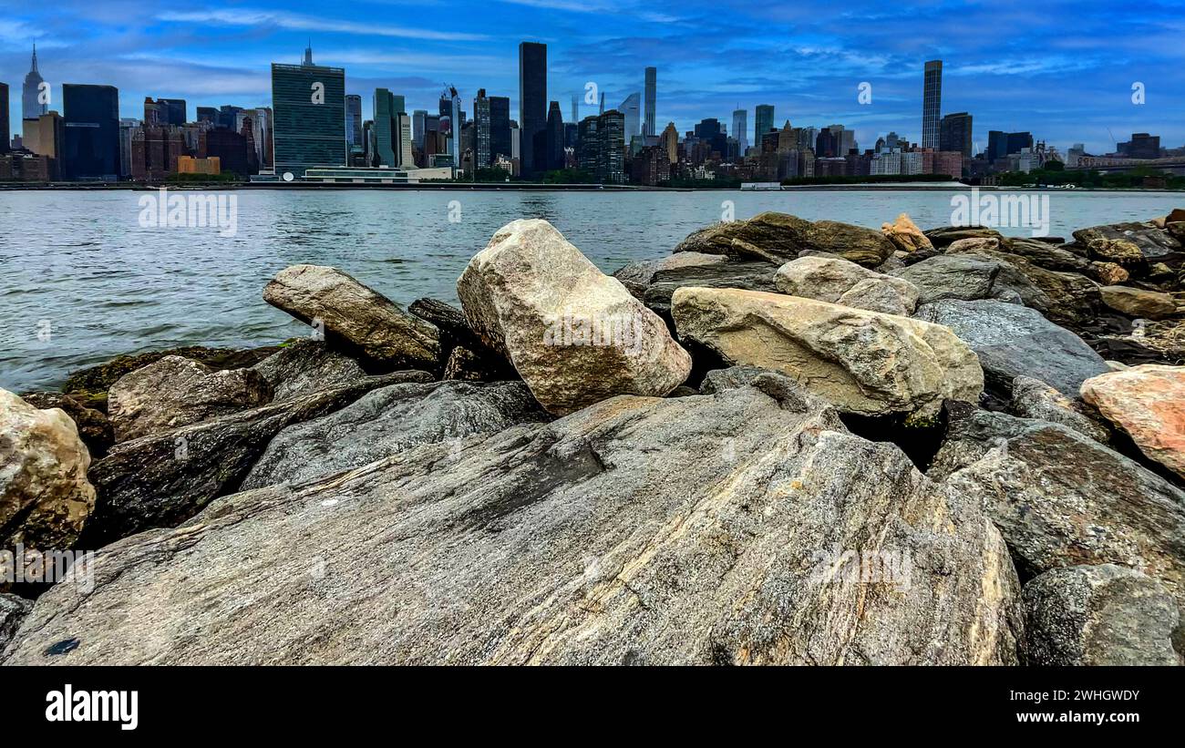 The New York skyline from the Long Island pier and observation deck is ...