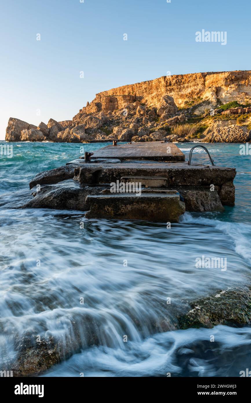Beach in Malta, ocean waves in long exposure photo Stock Photo - Alamy