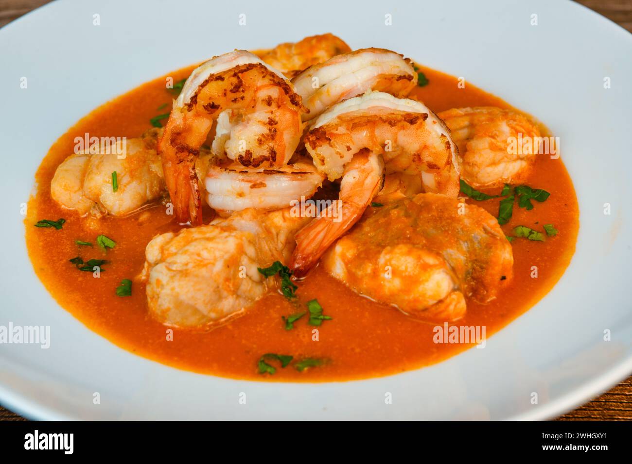 Recipe for Armorican-style monkfish tail, prawns, flambees with cognac ...