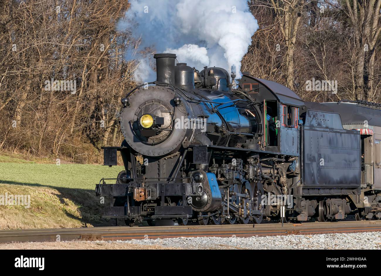 Close View of An Antique Steam Engine Blowing Steam While Traveling ...