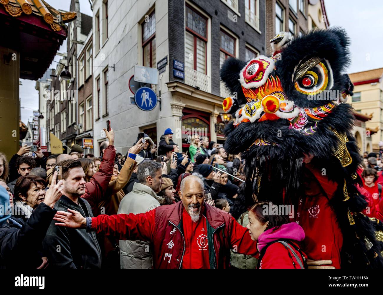 AMSTERDAM - Traditional lions and dragons during the celebration of the ...