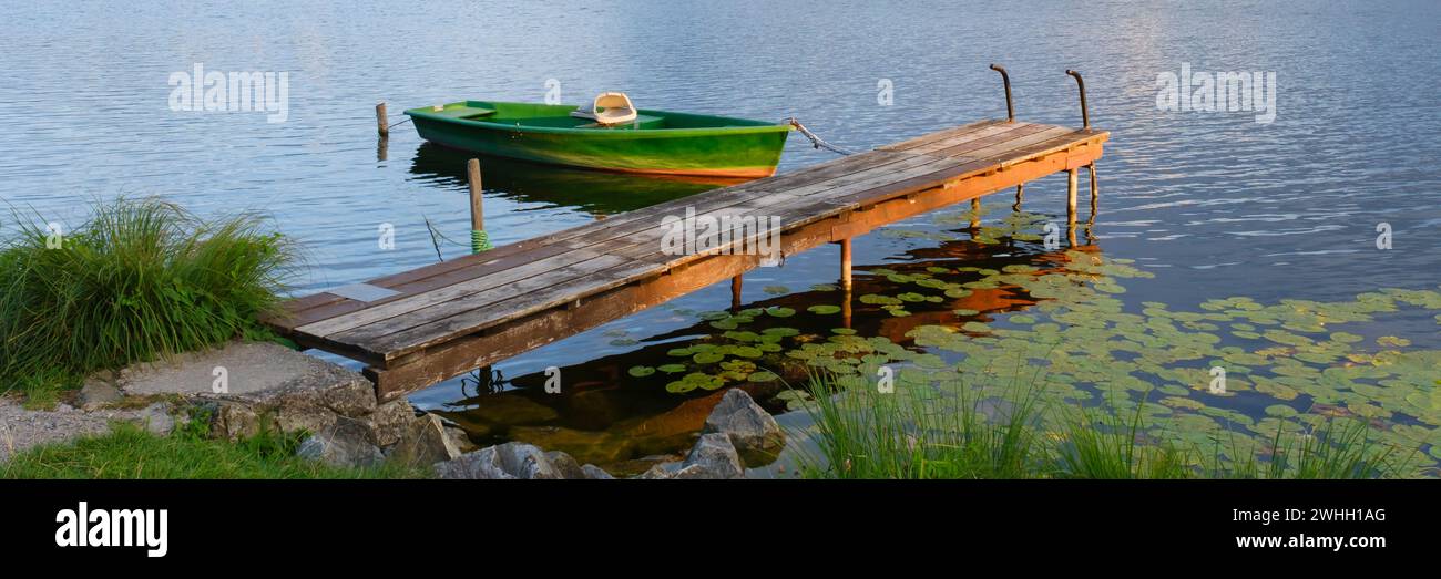 Boat landing stage with rowing boat hi-res stock photography and images ...