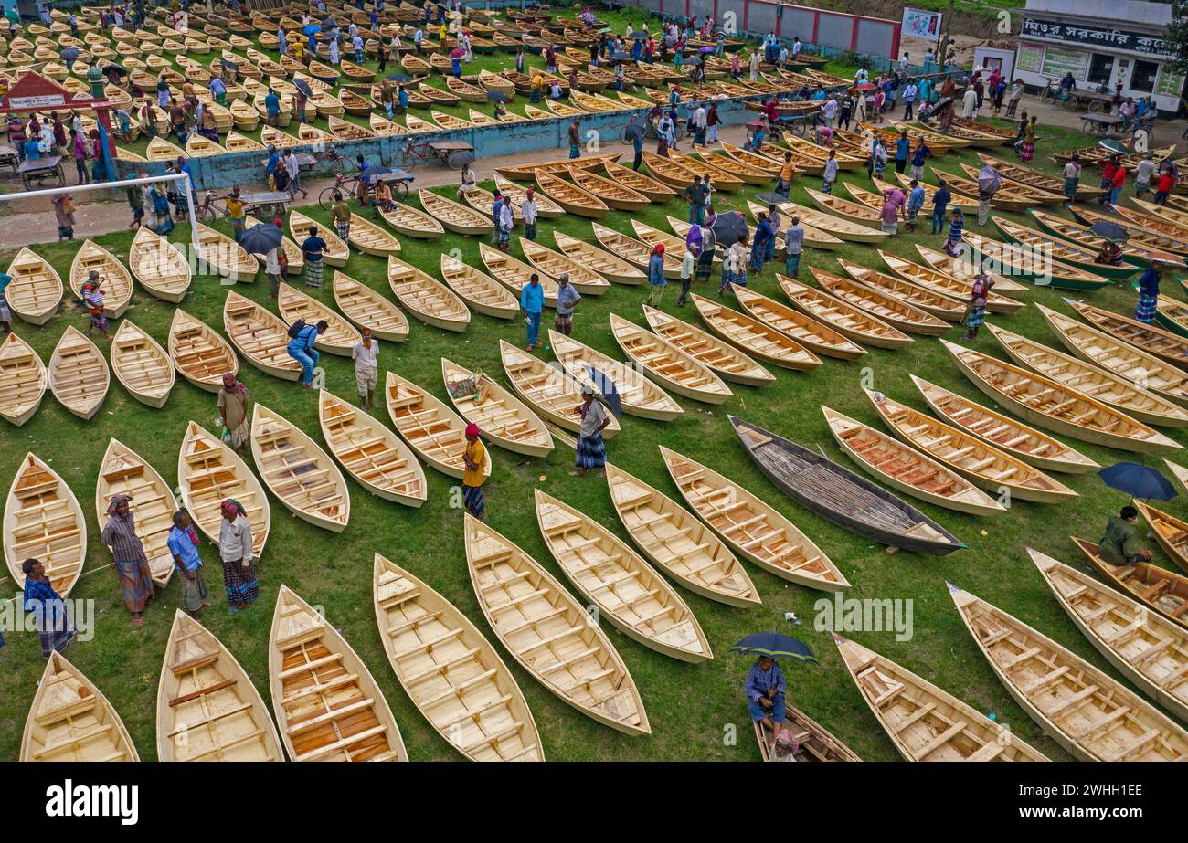 Aerial view of hundreds of small wooden boats are lined up for sale at ...