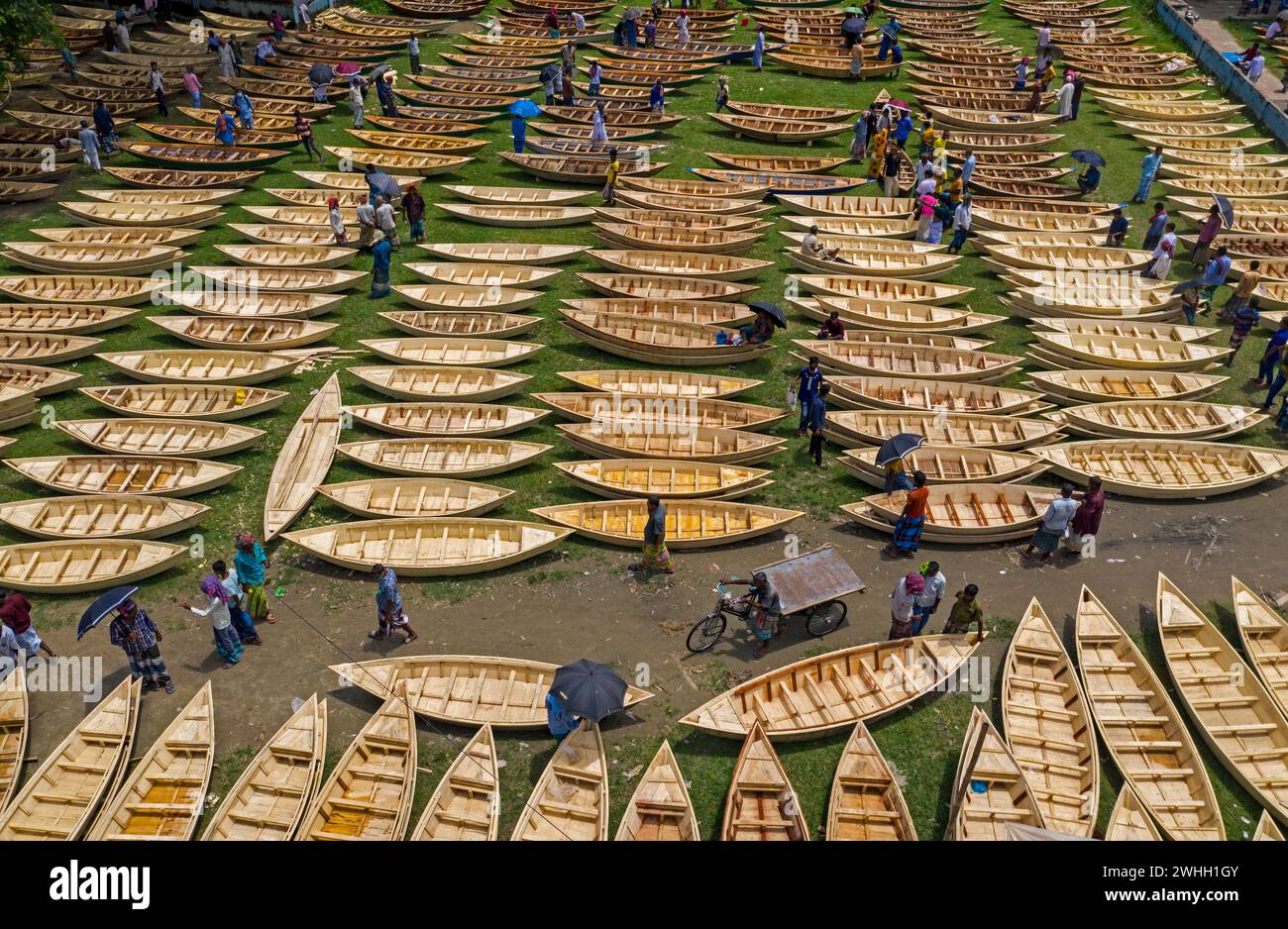 Aerial view of hundreds of small wooden boats are lined up for sale at ...