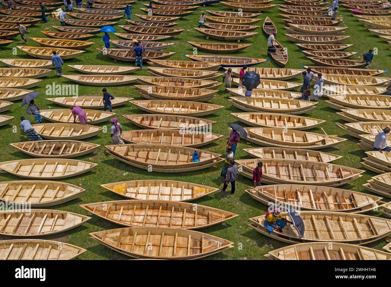 Aerial view of hundreds of small wooden boats are lined up for sale at ...