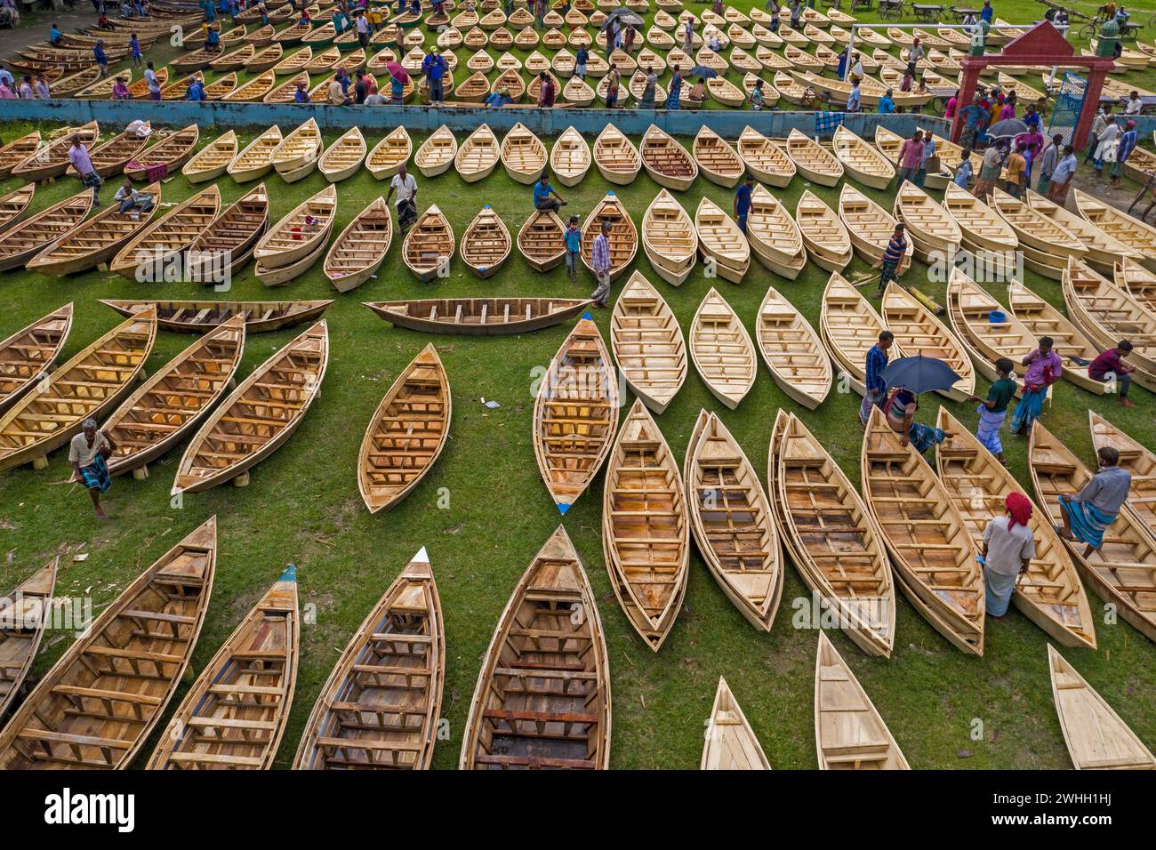 Aerial view of hundreds of small wooden boats are lined up for sale at ...
