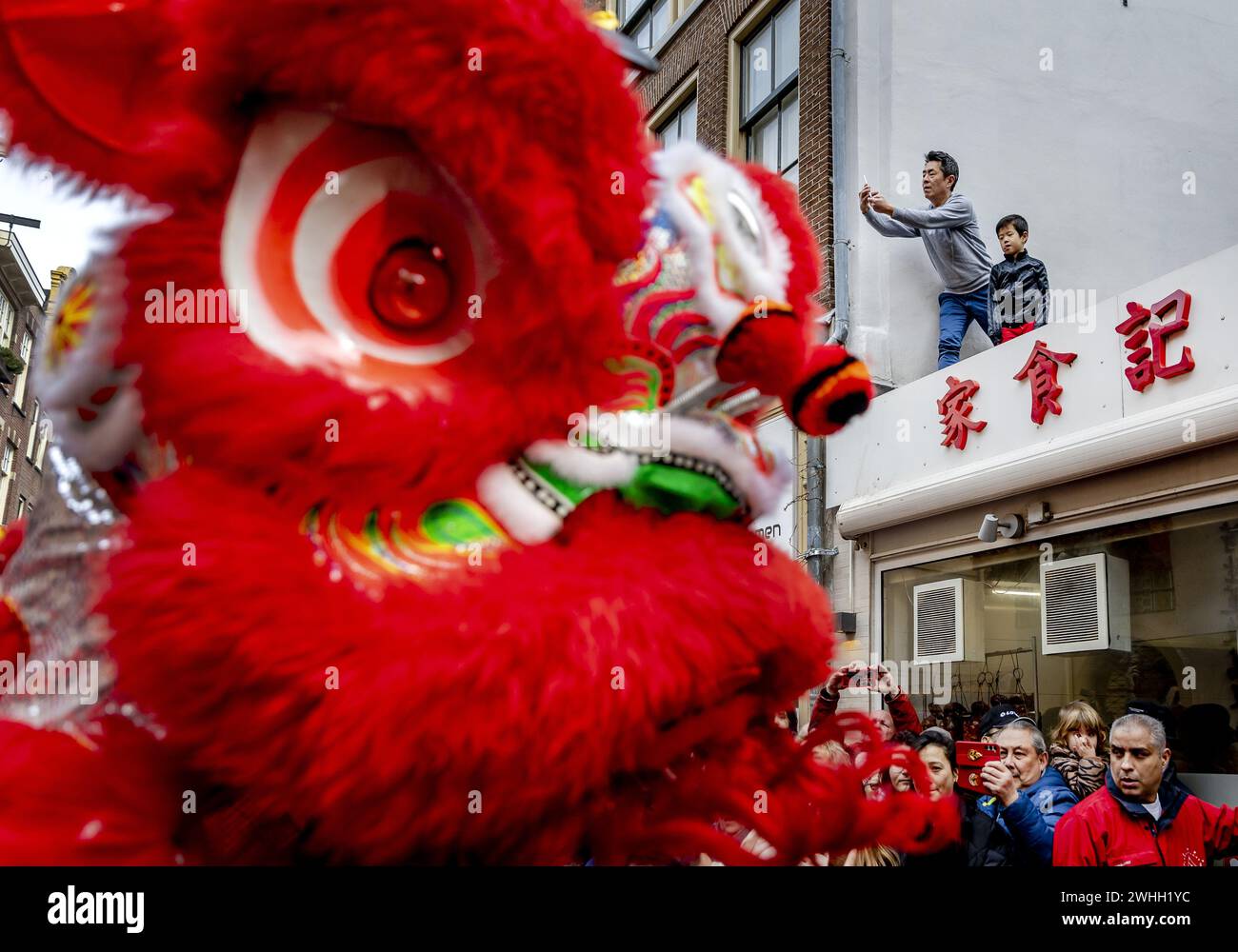 AMSTERDAM - Traditional lions and dragons during the celebration of the ...