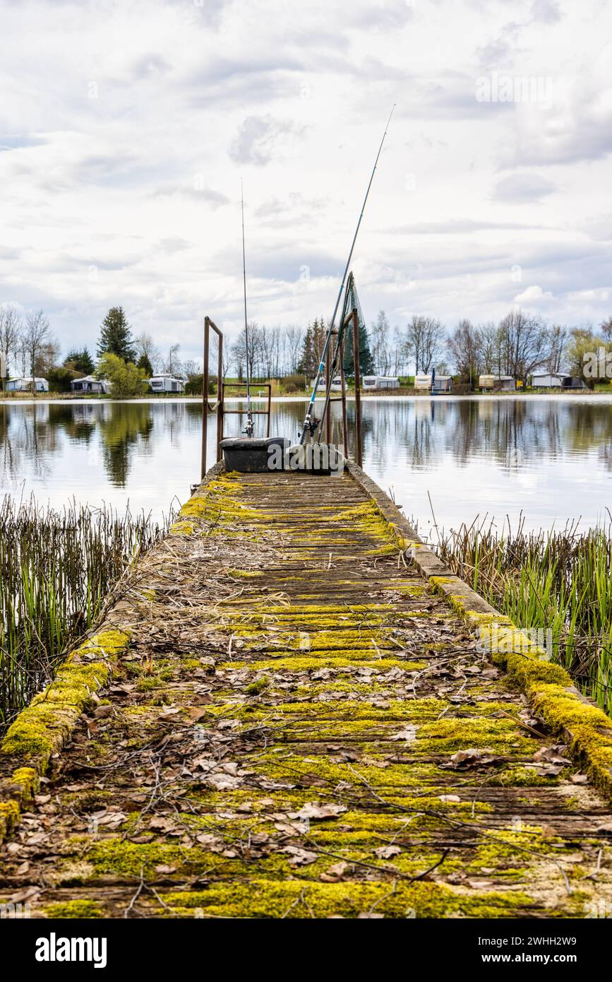 Old jetty with fishing equipment Stock Photo - Alamy