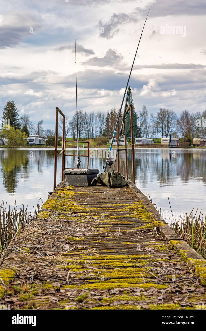 Old jetty with fishing equipment Stock Photo - Alamy